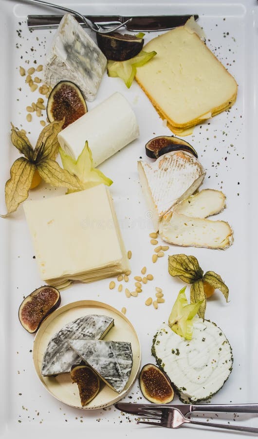 An Assortment of Cheese on a Platter Stock Photo - Image of slice, brie ...