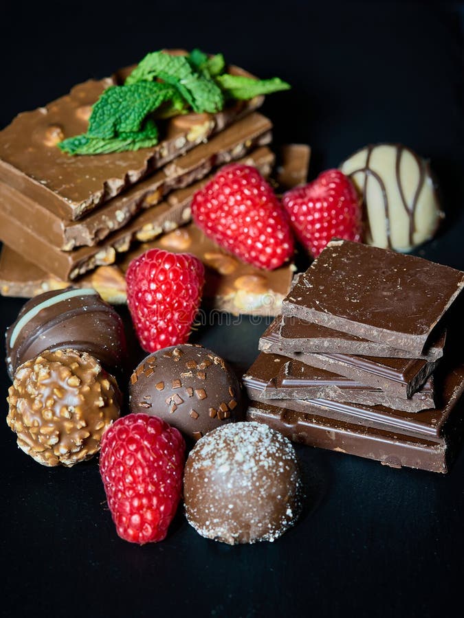 Chocolate Bars, Raspberries and Bonbons Stock Photo - Image of textured ...
