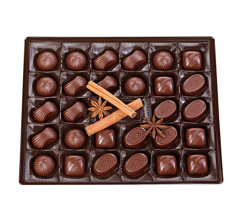 Assortment of Chocolates in a Plastic Box Close-up on a White ...