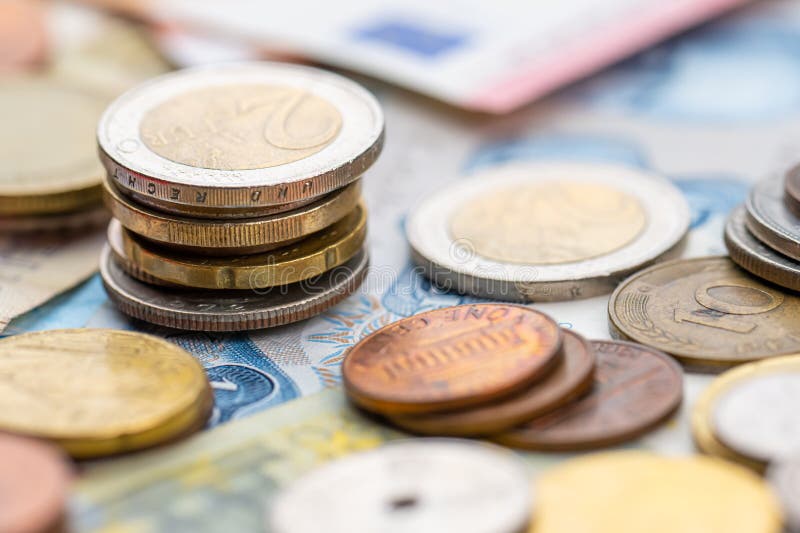 Assortment of Coins on Bank Notes from Different Countries.. Stock ...