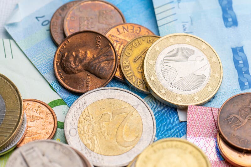 Assortment of Coins on Bank Notes from Different Countries.. Stock ...