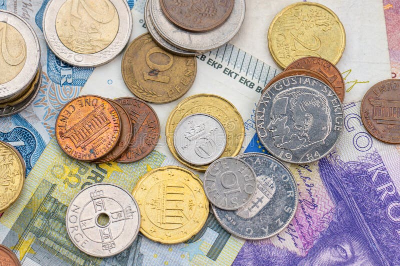 Assortment of Coins on Bank Notes from Different Countries.. Stock ...