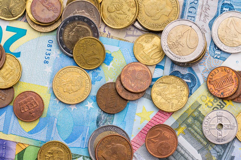 Assortment of Coins on Bank Notes from Different Countries.. Stock ...