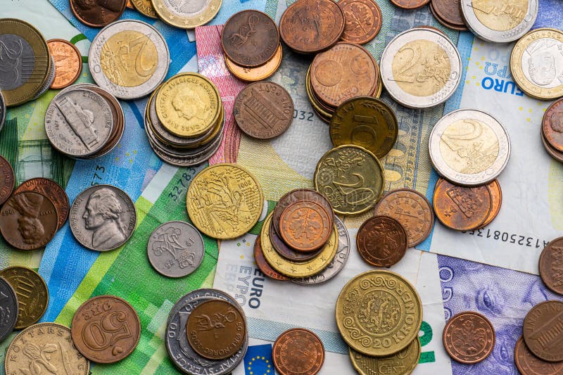 Assortment of Coins on Bank Notes from Different Countries.. Stock ...