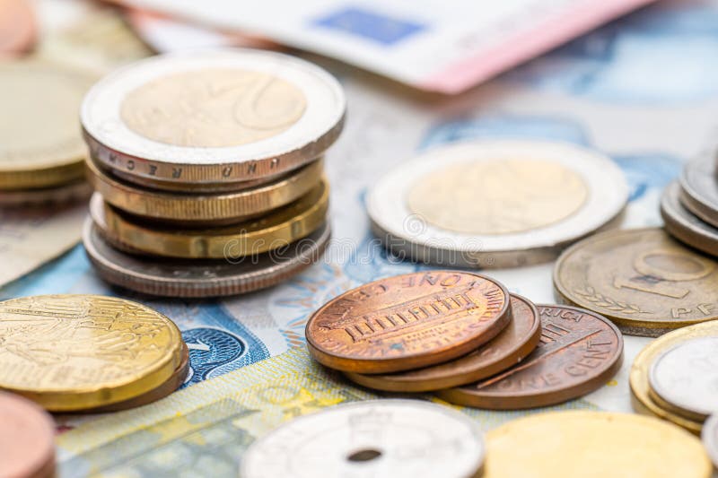 Assortment of Coins on Bank Notes from Different Countries.. Stock ...
