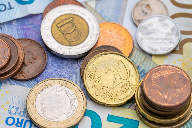 Assortment of Coins on Bank Notes from Different Countries.. Stock ...