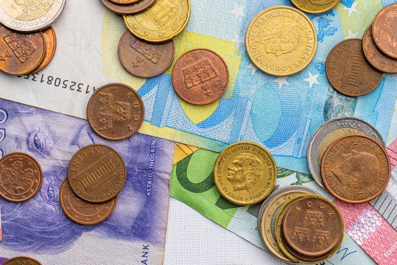 Assortment of Coins on Bank Notes from Different Countries.. Stock ...