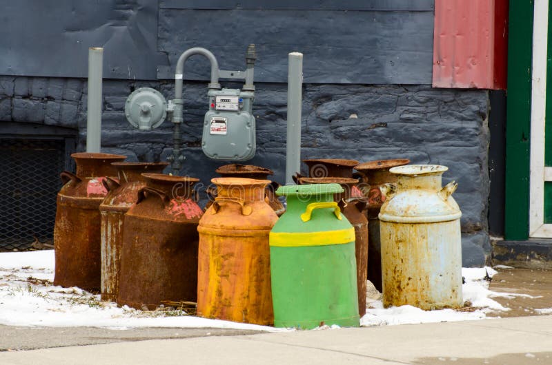 Old milk cans stock image. Image of rusty, colored, vintage - 30069231