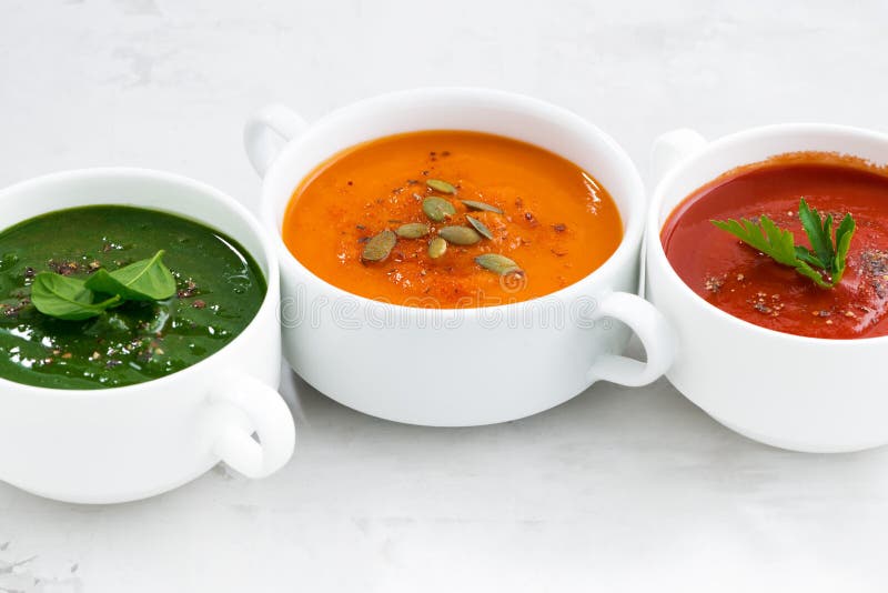 Assortment of Colorful Vegetable Cream Soup on a White Table Stock ...