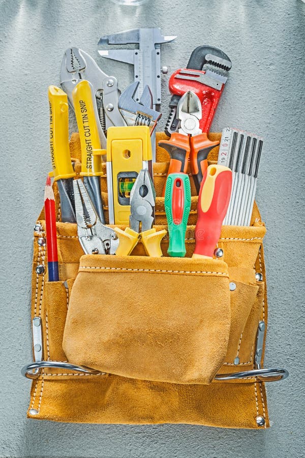 Assortment of Construction Tooling in Tool Belt on Concrete Back Stock ...