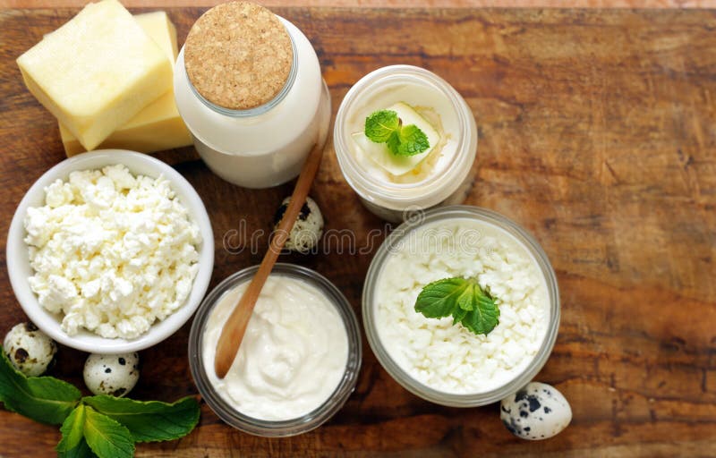 Assortment of Dairy Products on a Wooden Table Stock Photo - Image of ...