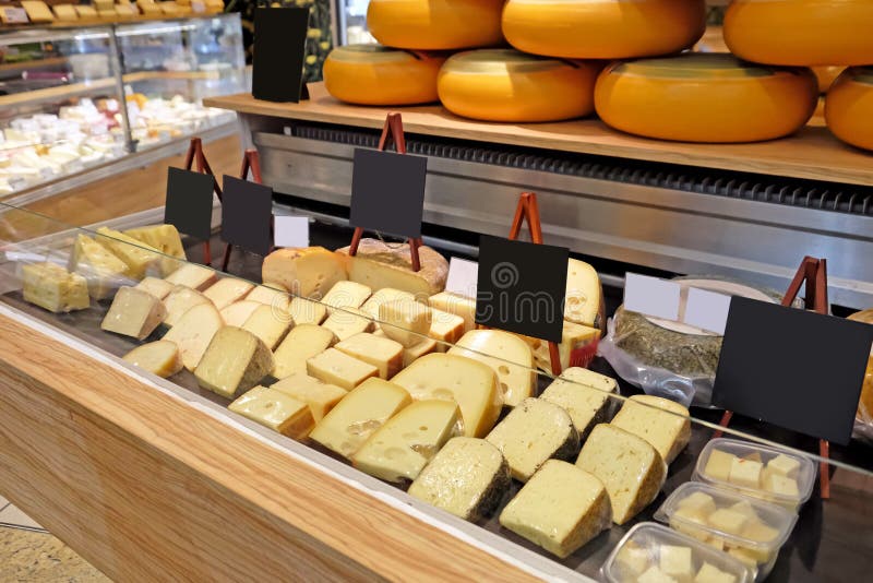 Assortment of Different Cut Cheese in Shop Stock Photo - Image of ...
