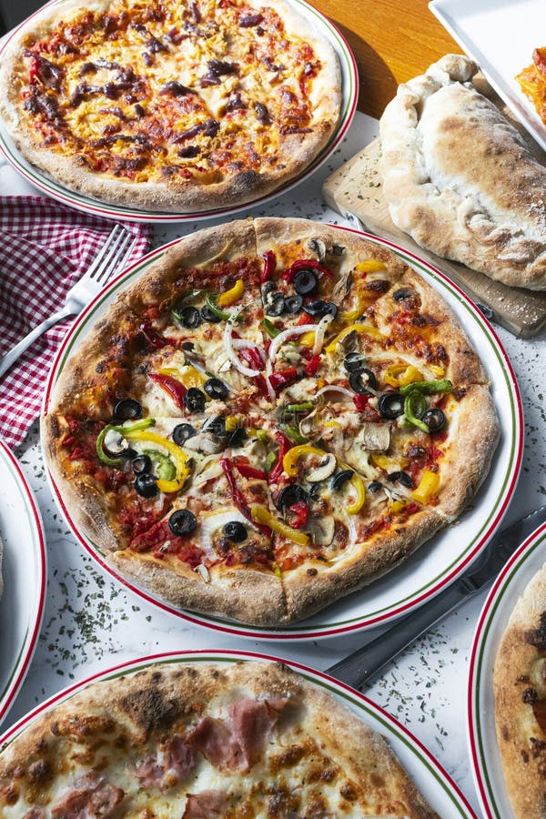 Assortment of Different Pizzas on the Table for Tasting or Preparing ...