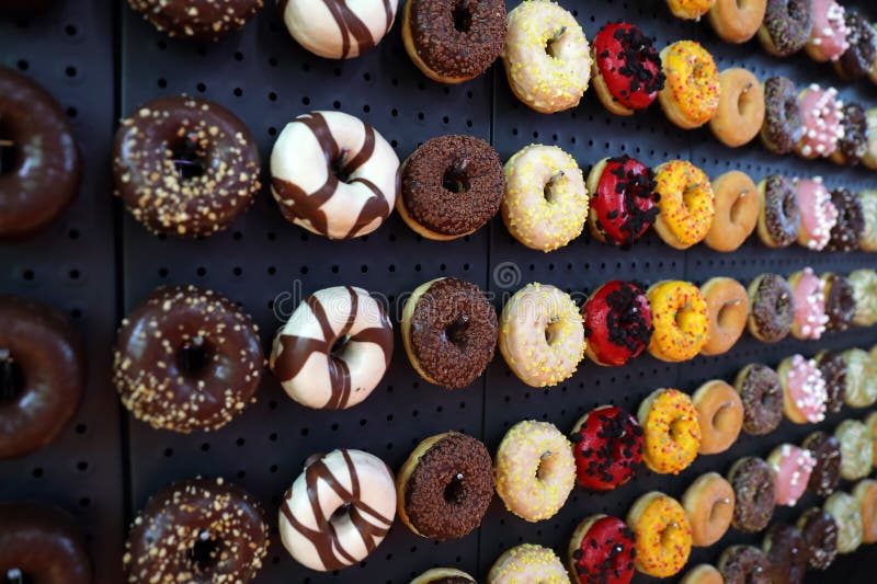 Assortment of Donuts with Various Colors and Toppings Stock Image ...