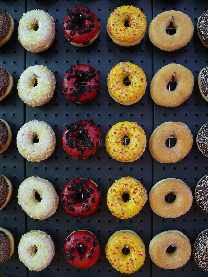 Assortment of Donuts with Various Colors and Toppings Stock Image ...