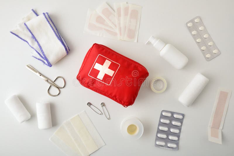 Assortment of Emergency First Aid Kit Objects on White Table Stock ...