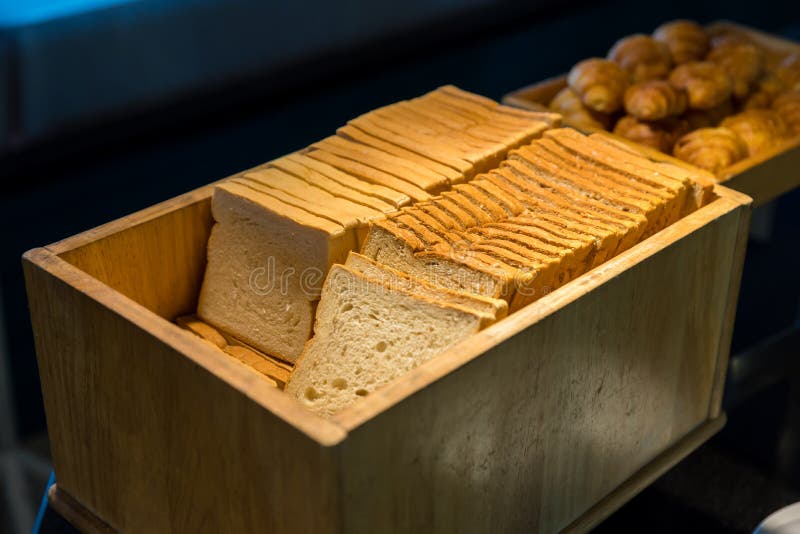 Assortment of Fresh Bread on Table in Buffet. Sliced White Bread Stock ...