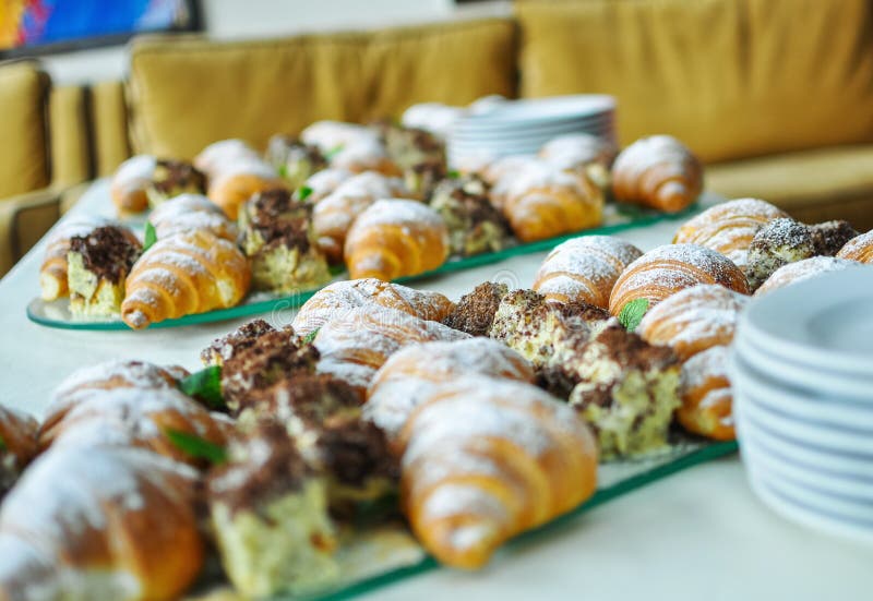 Assortment of Fresh Pastry on Table in Buffet. Croissants and Cakes ...