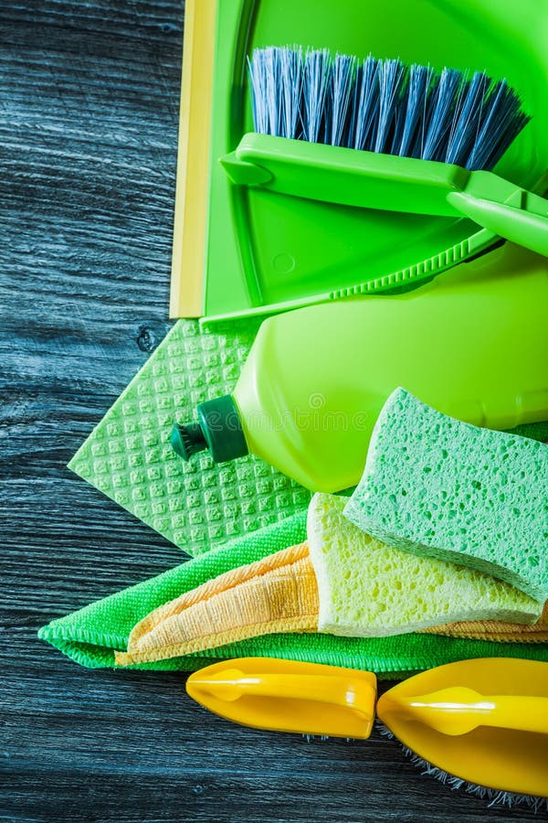 Assortment of Household Cleaning Tools on Wooden Board Stock Image ...