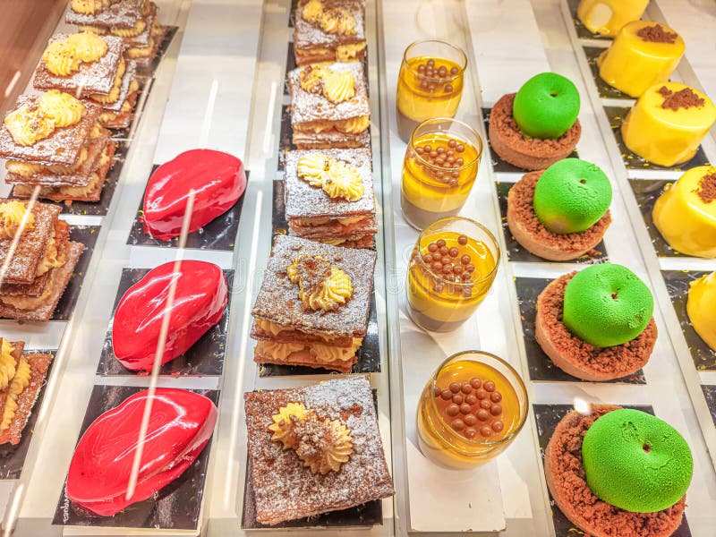 Assortment of Many Colored Cakes, Puff Pastry, Apple, Custard Stock ...