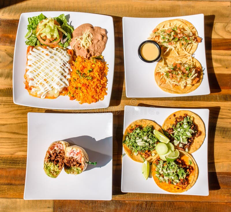 Assortment of Mexican Dishes on White Plates Stock Photo - Image of ...