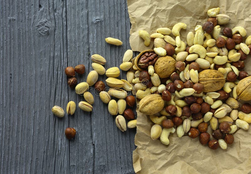 Assortment of Nuts on a Dark Wooden Table. View from Above Stock Photo ...