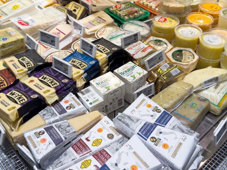 Assortment of Packaged Cheeses on Display in Grocery Store Editorial ...