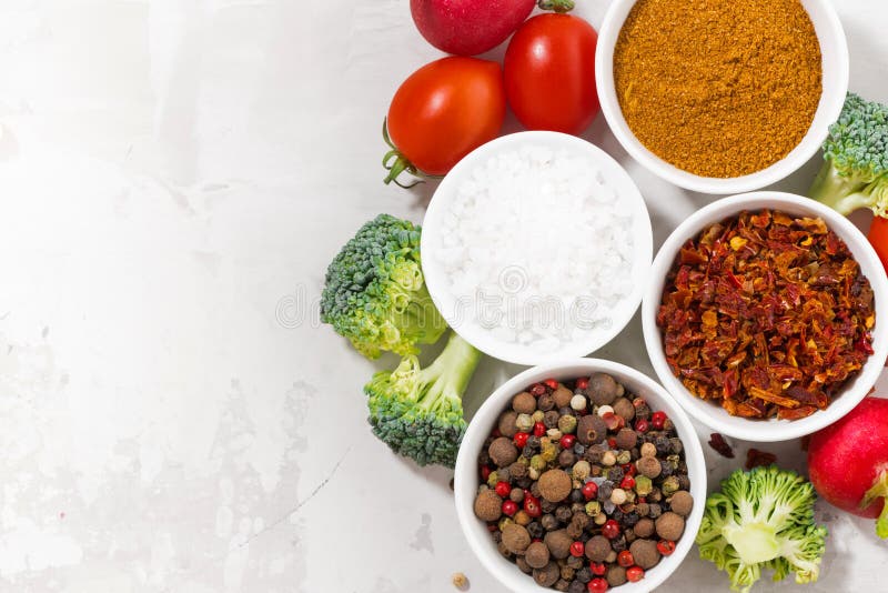 Assortment of Pepper, Salt, Spices and Fresh Vegetables Stock Photo ...