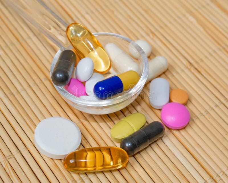 Assortment of Pharmaceutical Preparations, Tablets and Capsules on a ...
