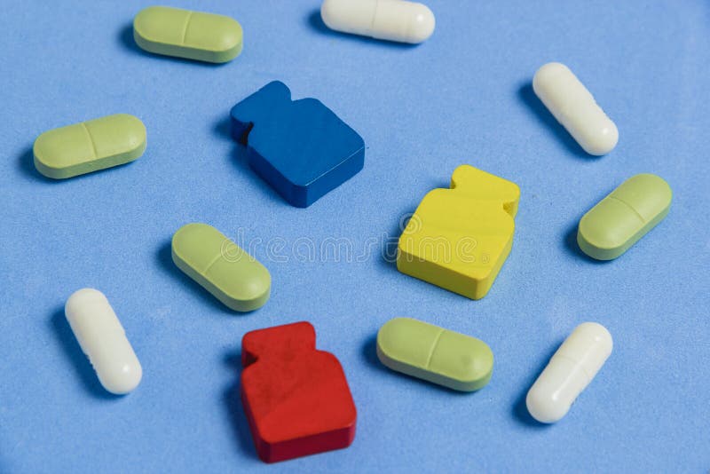 Assortment of Pills, Tablets and Capsules on Blue Table. Stock Photo ...