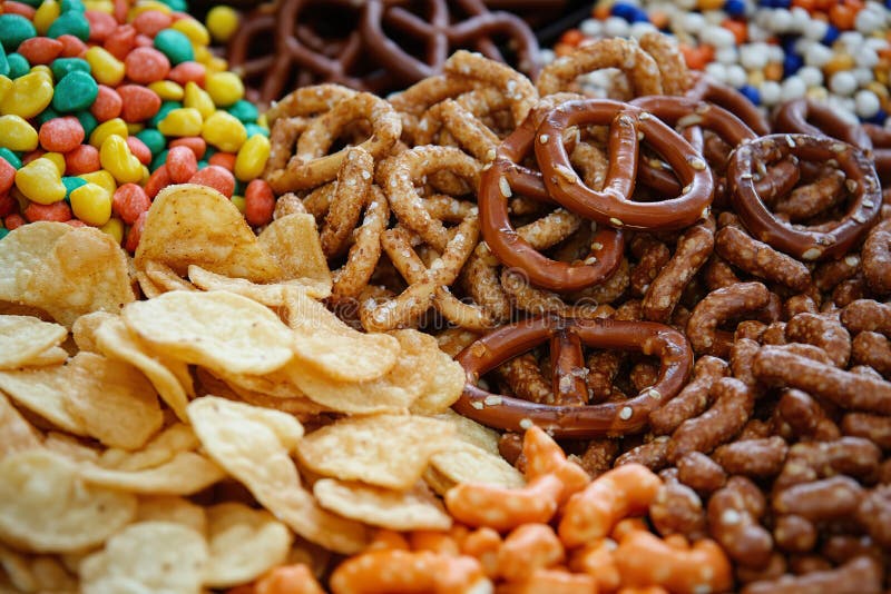 An Assortment of Savory Snacks Including Chips, Crackers, Pretzels, and ...