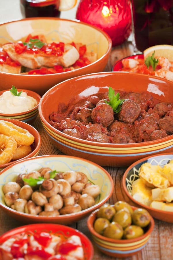 Assortment of Spanish Tapas and Sangria on a Rustic Table Stock Image ...