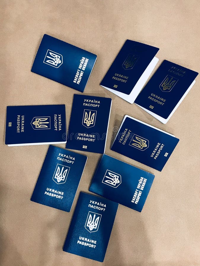 Assortment of Ukrainian Passports Spread on a Beige Surface Stock Image ...