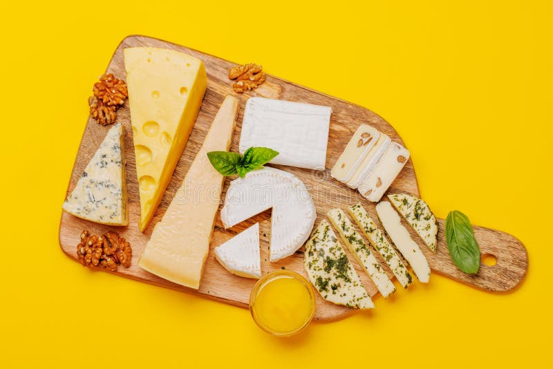 An Assortment of Various Cheeses Arranged on a Board, Highlighting ...