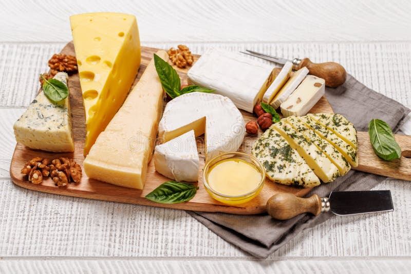 An Assortment of Various Cheeses Arranged on a Board, Highlighting ...