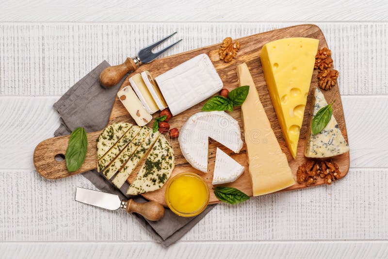 An Assortment of Various Cheeses Arranged on a Board, Highlighting ...