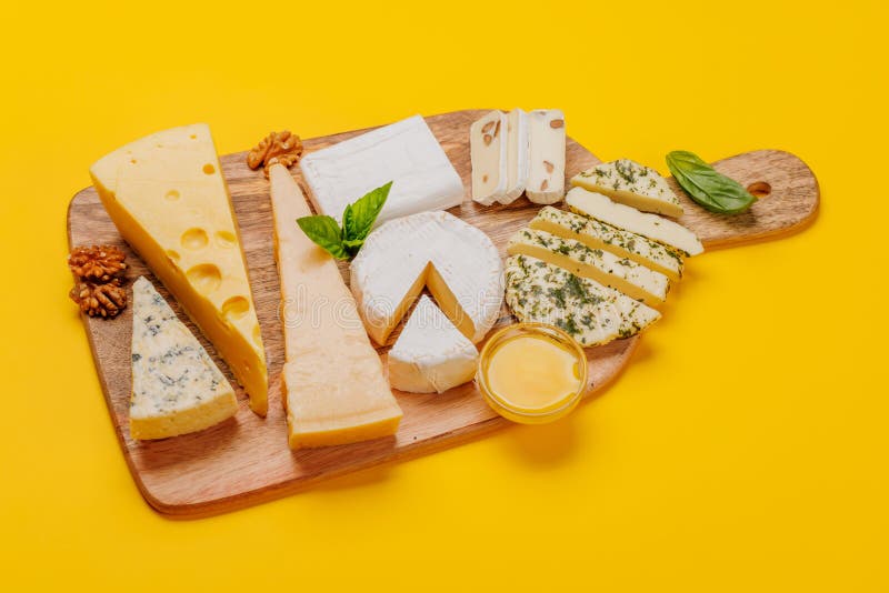 An Assortment of Various Cheeses Arranged on a Board, Highlighting ...