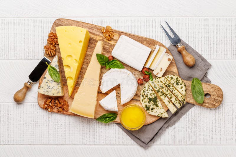 An Assortment of Various Cheeses Arranged on a Board, Highlighting ...
