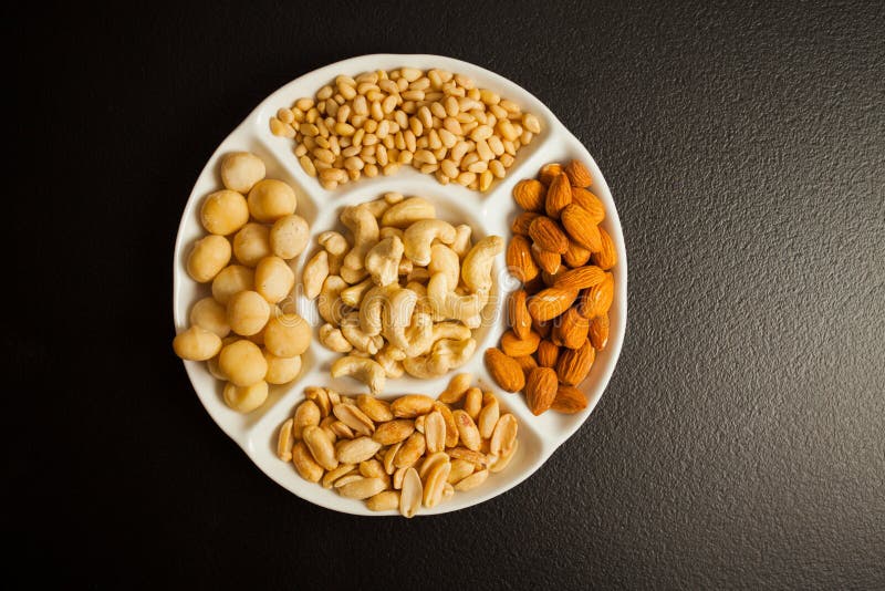 White Plate with Variety of Nuts Close Up Stock Image - Image of kernel ...