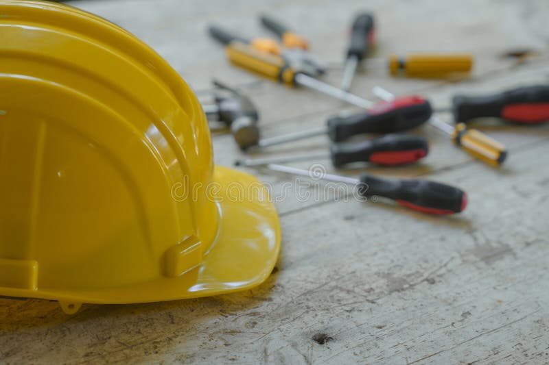 Assortment of Well-used Hand Tools Spread Out on a Worn Wooden Surface ...