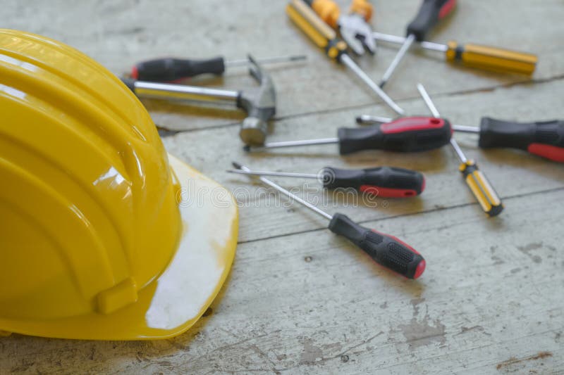 Assortment of Well-used Hand Tools Spread Out on a Worn Wooden Surface ...