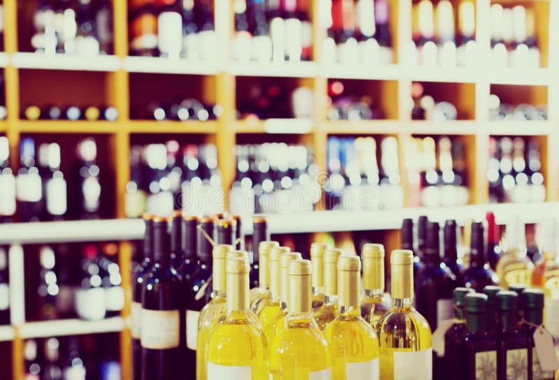 Assortment of wine bottles stock image. Image of choosing - 94779235