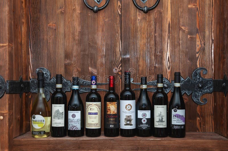 Assortment of Wine Bottles. a Rack with Bottles of Wine at the ...