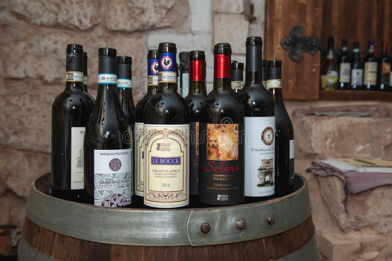 Assortment of Wine Bottles. a Rack with Bottles of Wine at the ...