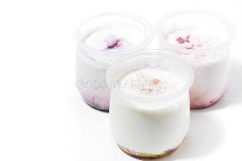 Assortment of Yogurts with Fruit Additives on White Table Stock Photo ...