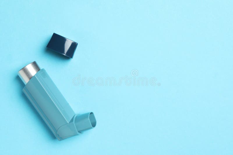 Asthma Inhaler on Light Blue Background, Top View. Space for Text Stock ...