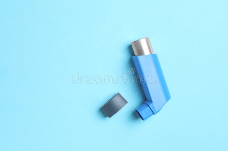 Asthma Inhaler on Light Blue Background, Top View. Space for Text Stock ...