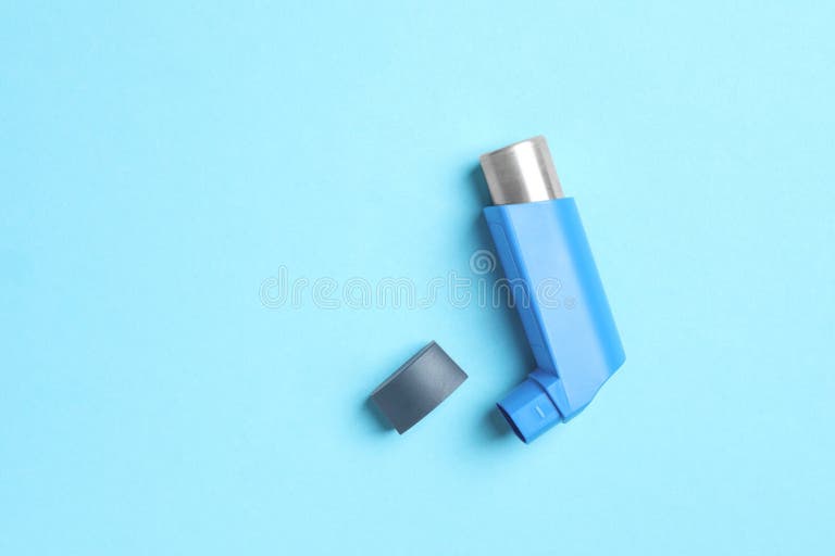 Asthma Inhaler on Light Blue Background, Top View. Space for Text Stock ...