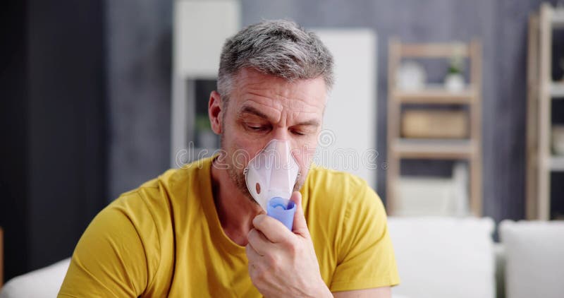 Asthma Patient Breathing Using Oxygen Mask Stock Photo - Image of ...