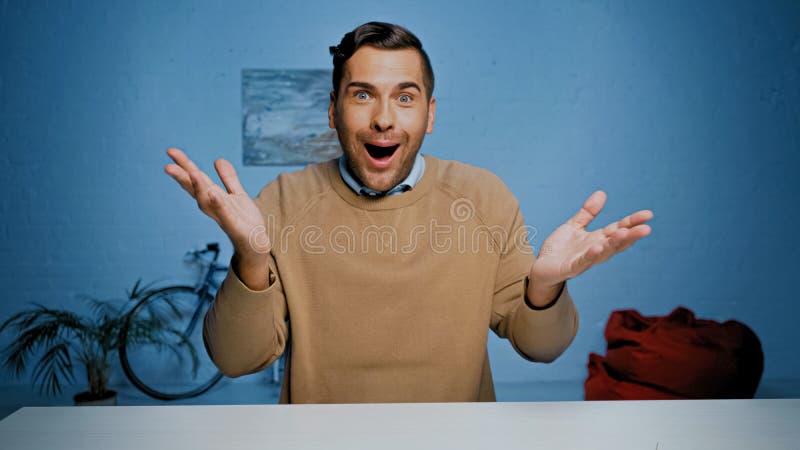 Astonished Man Pointing with Hands at Table. Stock Photo - Image of ...